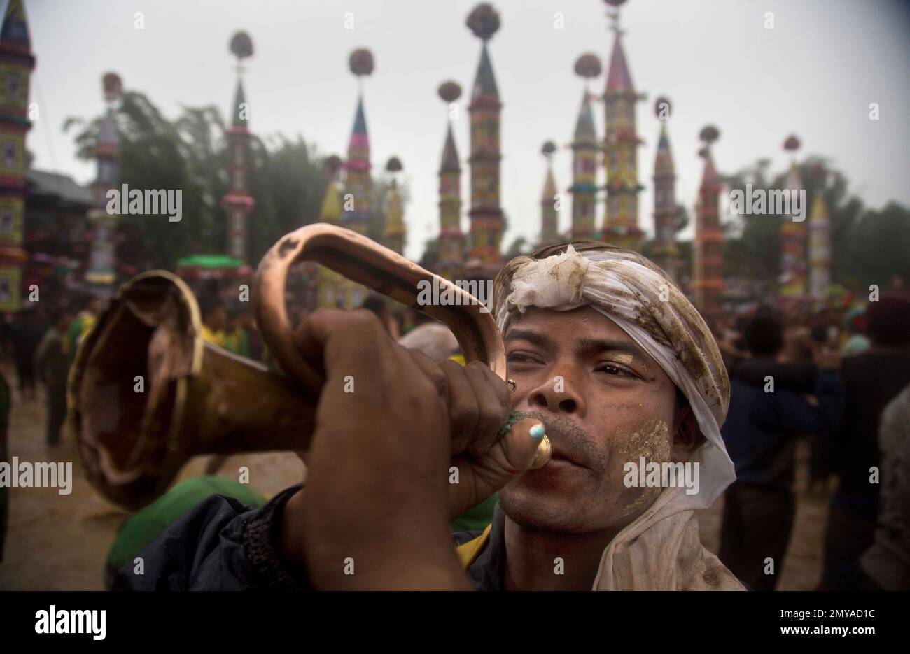 An Indian Pnar or Jaintia tribal man blows a bugle during Behdienkhlam ...