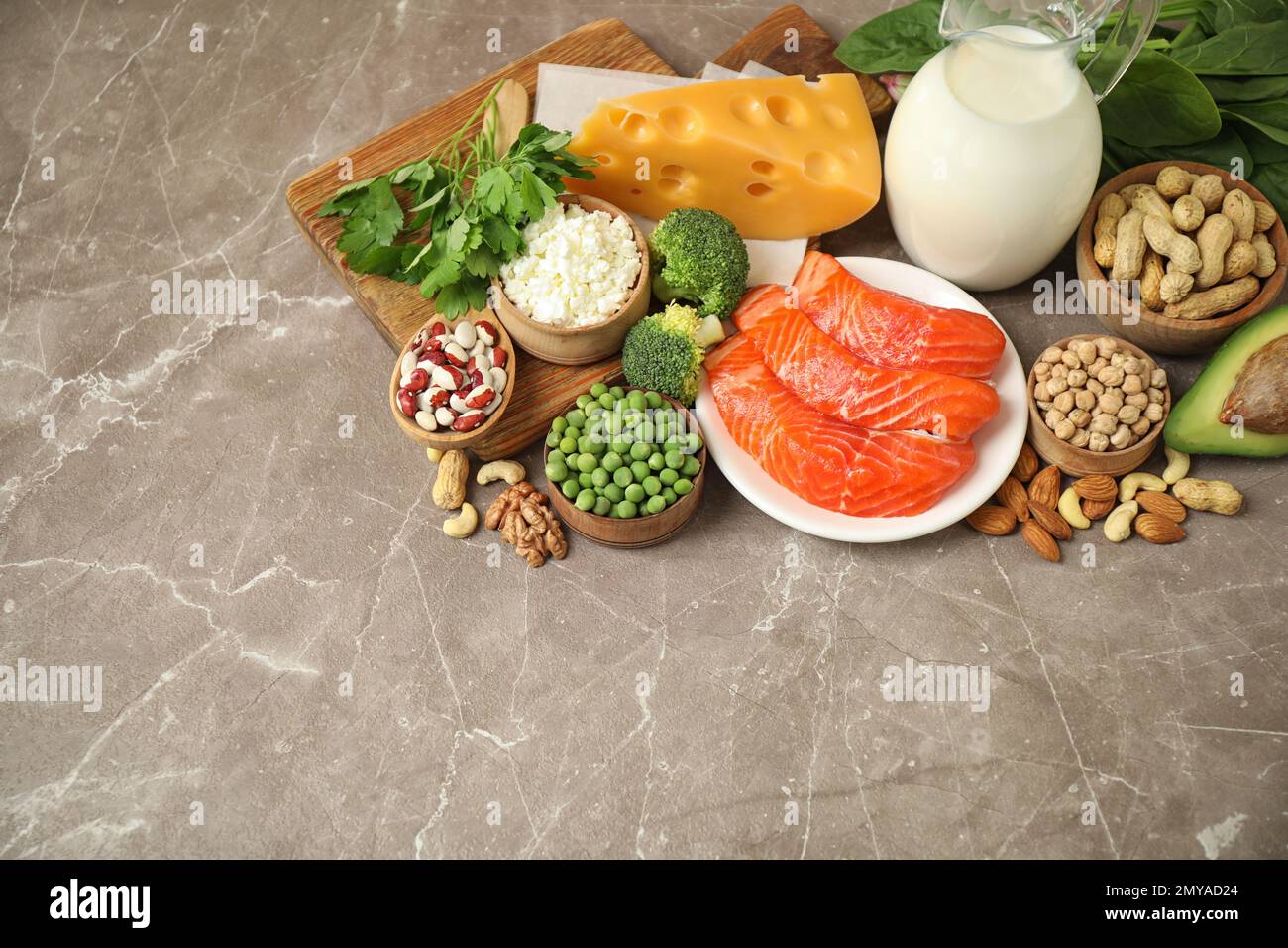 Different products rich in protein on marble table Stock Photo - Alamy