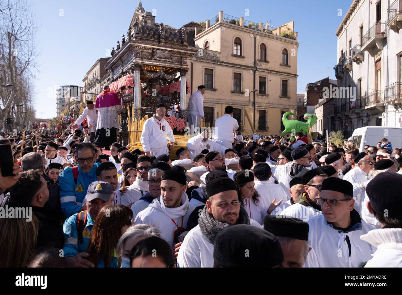 The procession with the relics of Saint Agatha seen on the street of ...