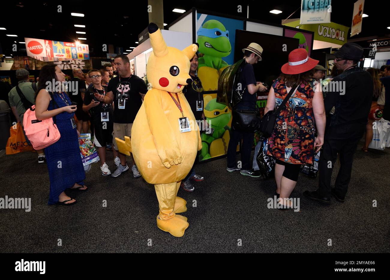 Denise Zesati, dressed as Pokemon Pikachu, stands in line to buy ...