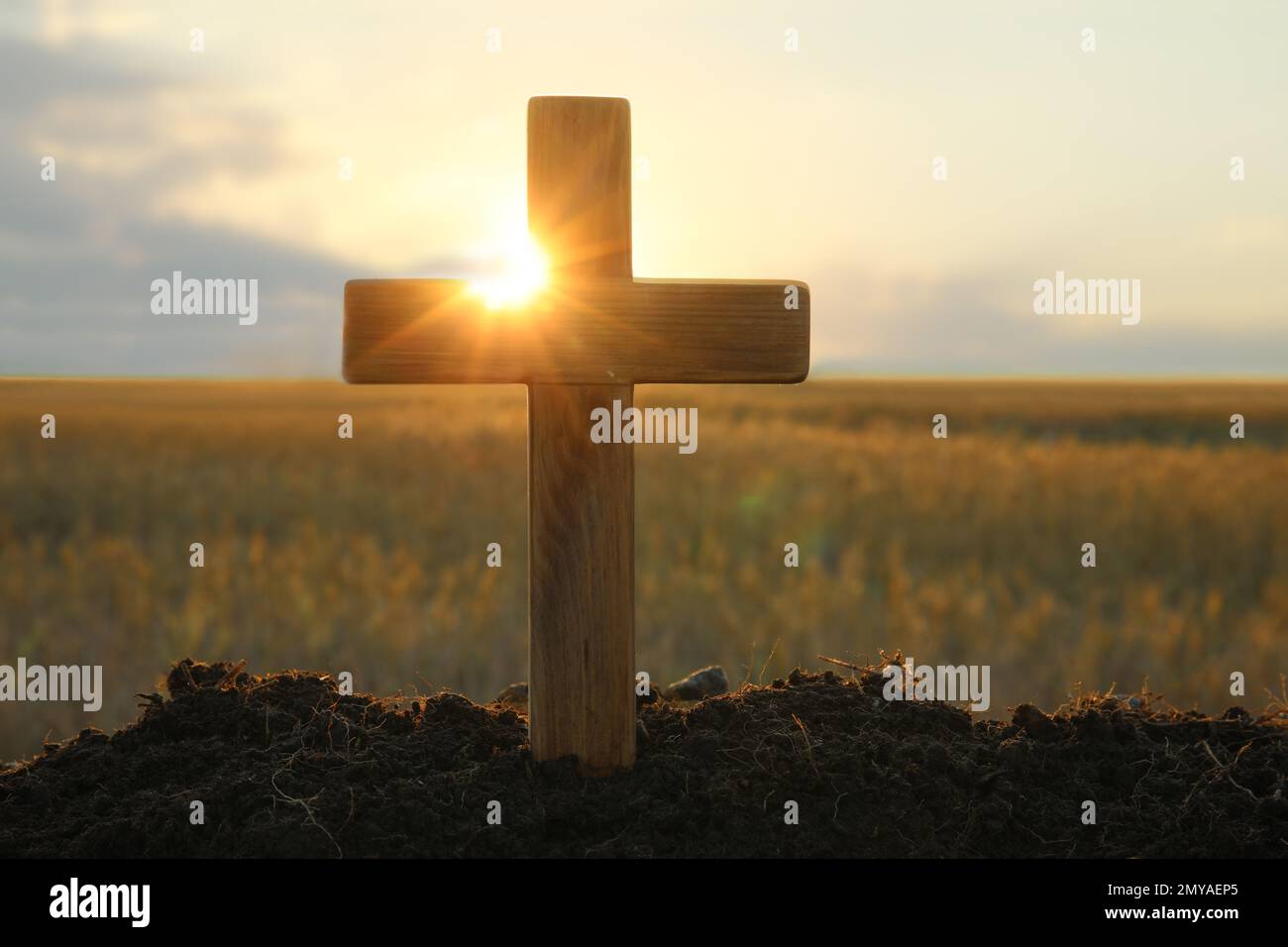 Wooden Christian cross outdoors at sunrise. Religion concept Stock ...