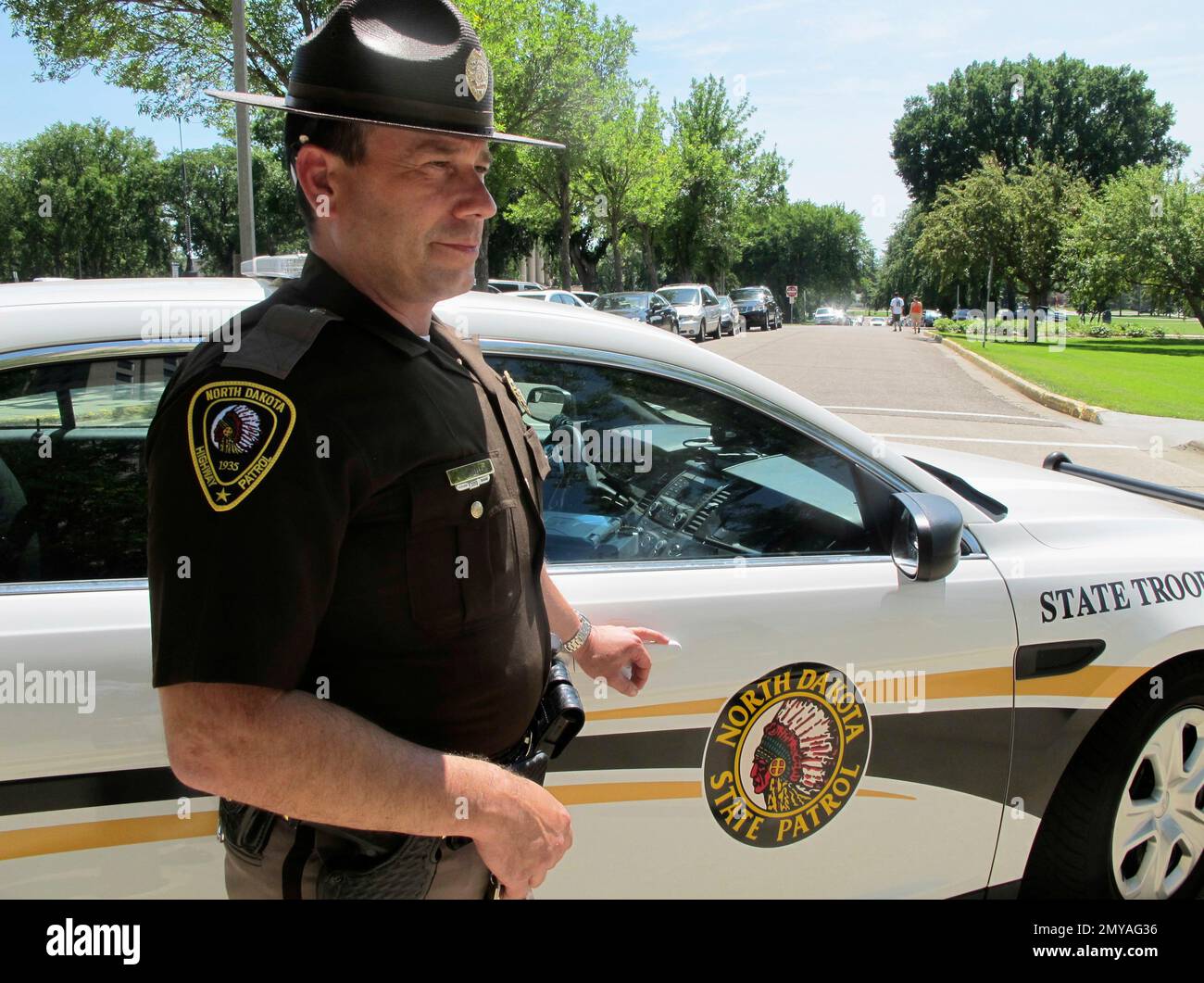 In this Thursday, July 19, 2016, photo, trooper Rob Moyle poses beside ...