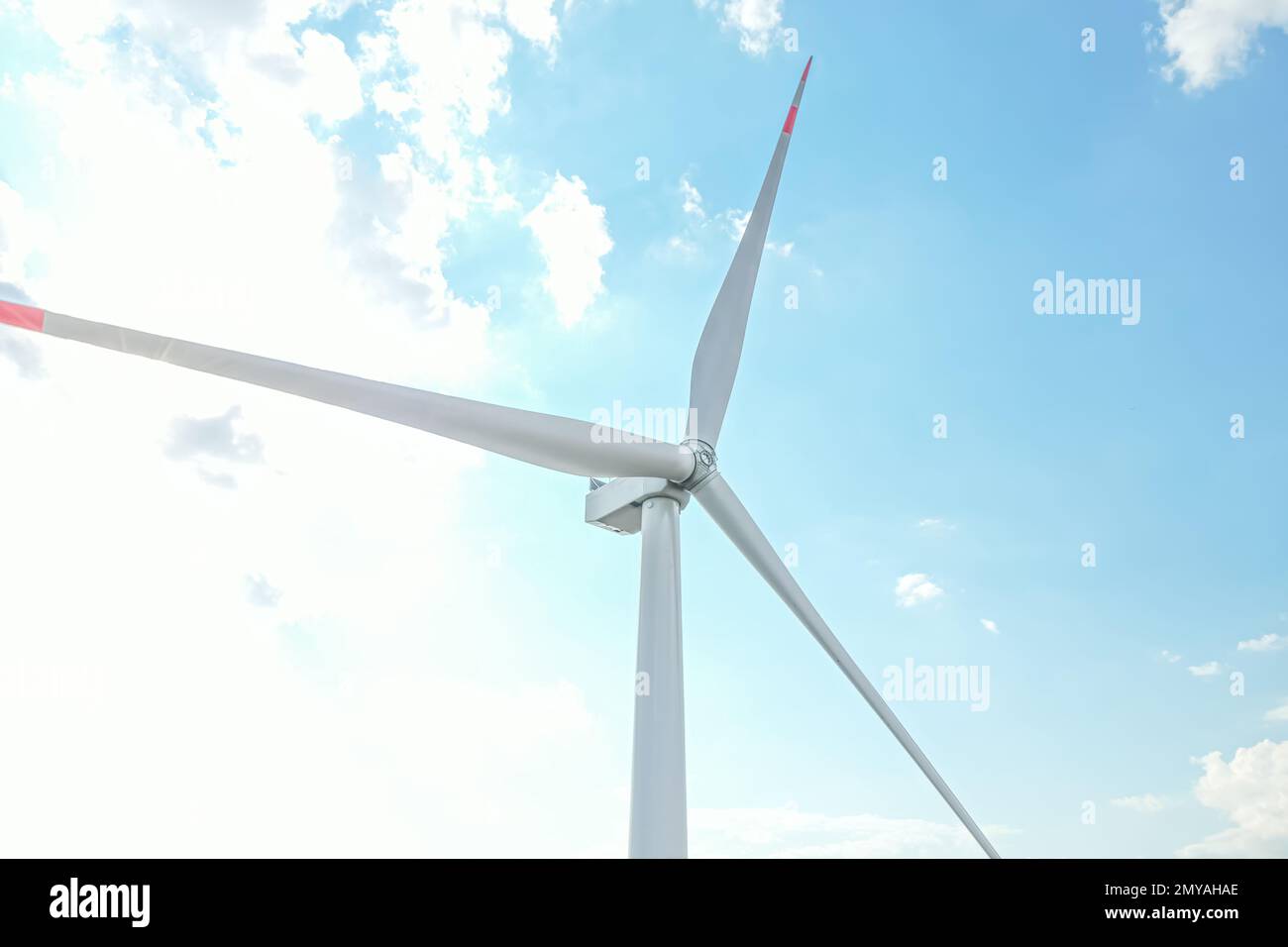 Modern windmill against sky with clouds. Energy efficiency Stock Photo ...