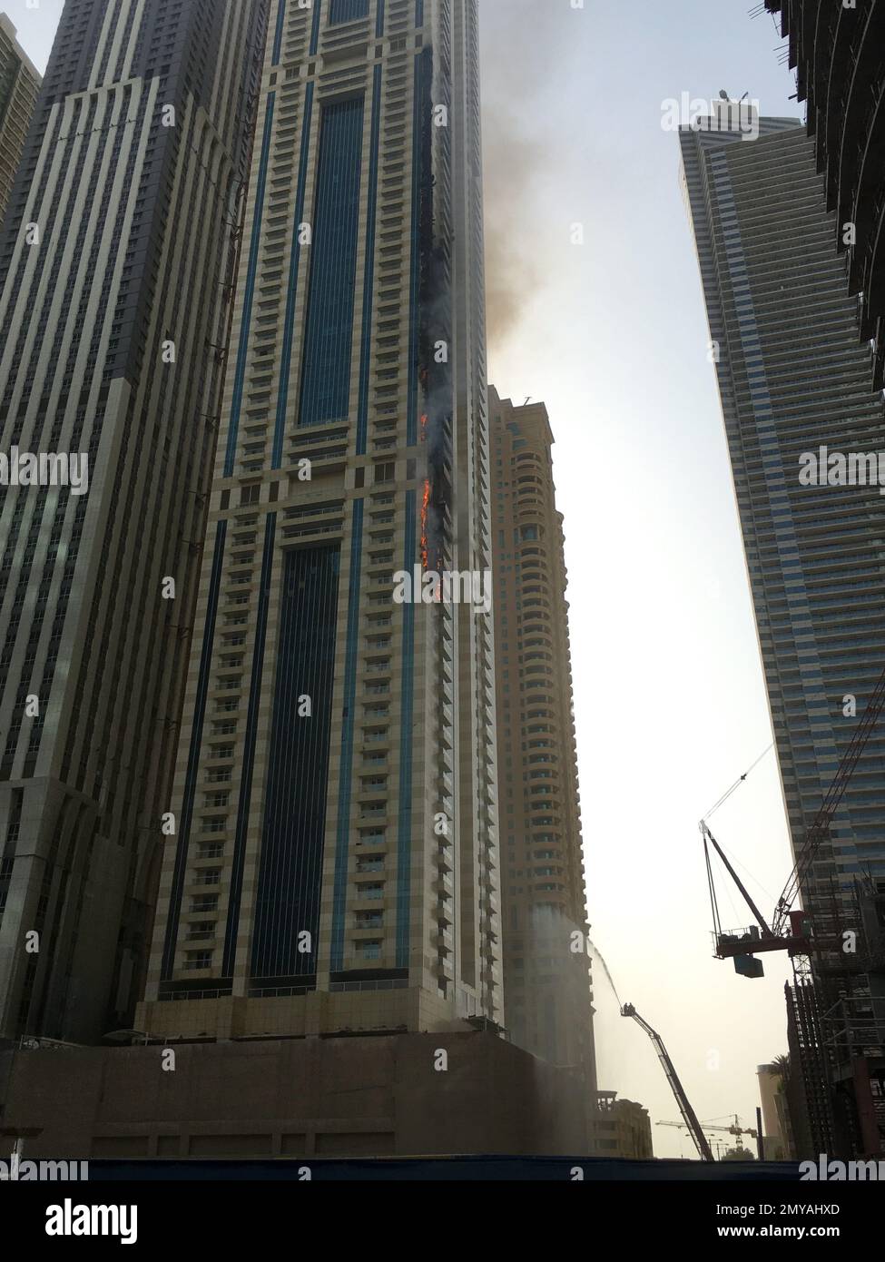 A fire rages at a skyscraper in the Dubai Marina section of Dubai ...