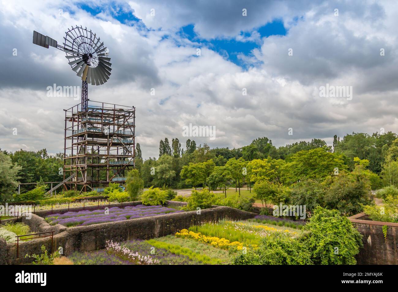 a steel tower with a large windmill, used to serve as a water pump. In ...