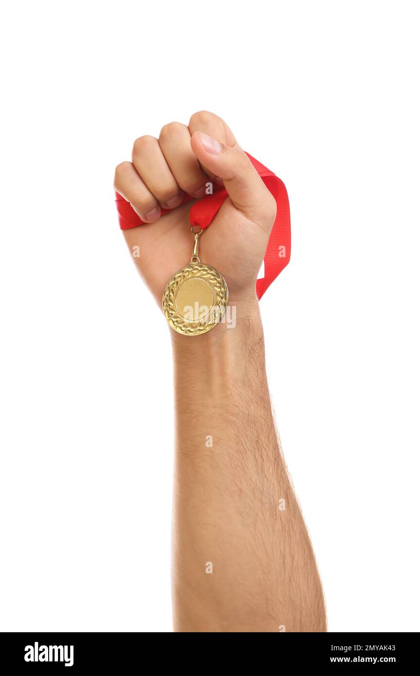 Man holding golden medal on white background, closeup. Space for design ...