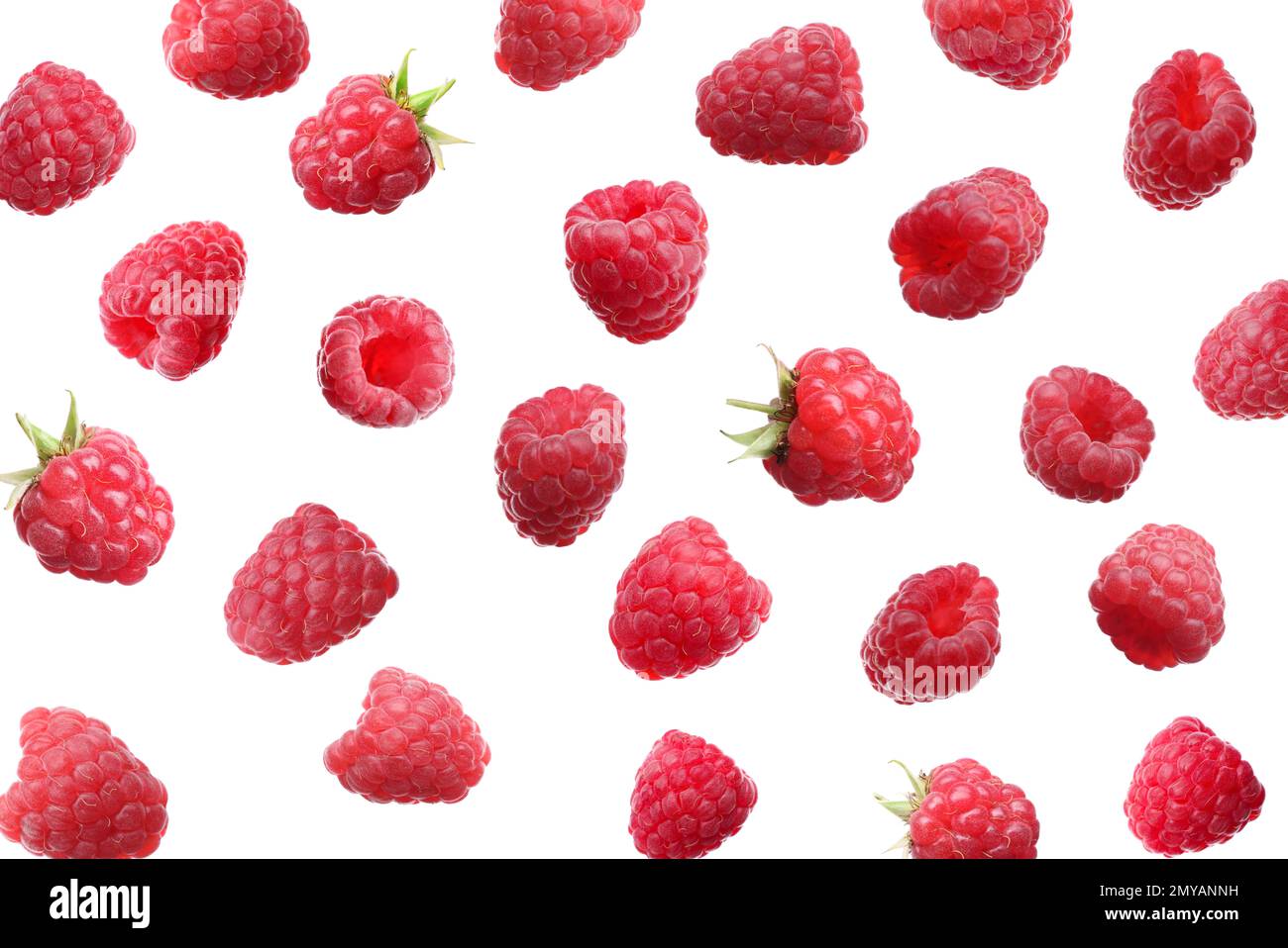 Fresh ripe raspberries falling on white background Stock Photo - Alamy
