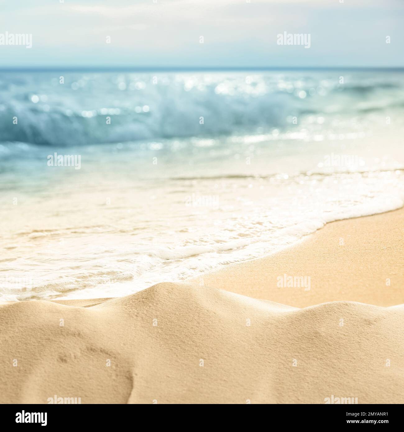 Ocean waves rolling on sandy beach, closeup view Stock Photo - Alamy