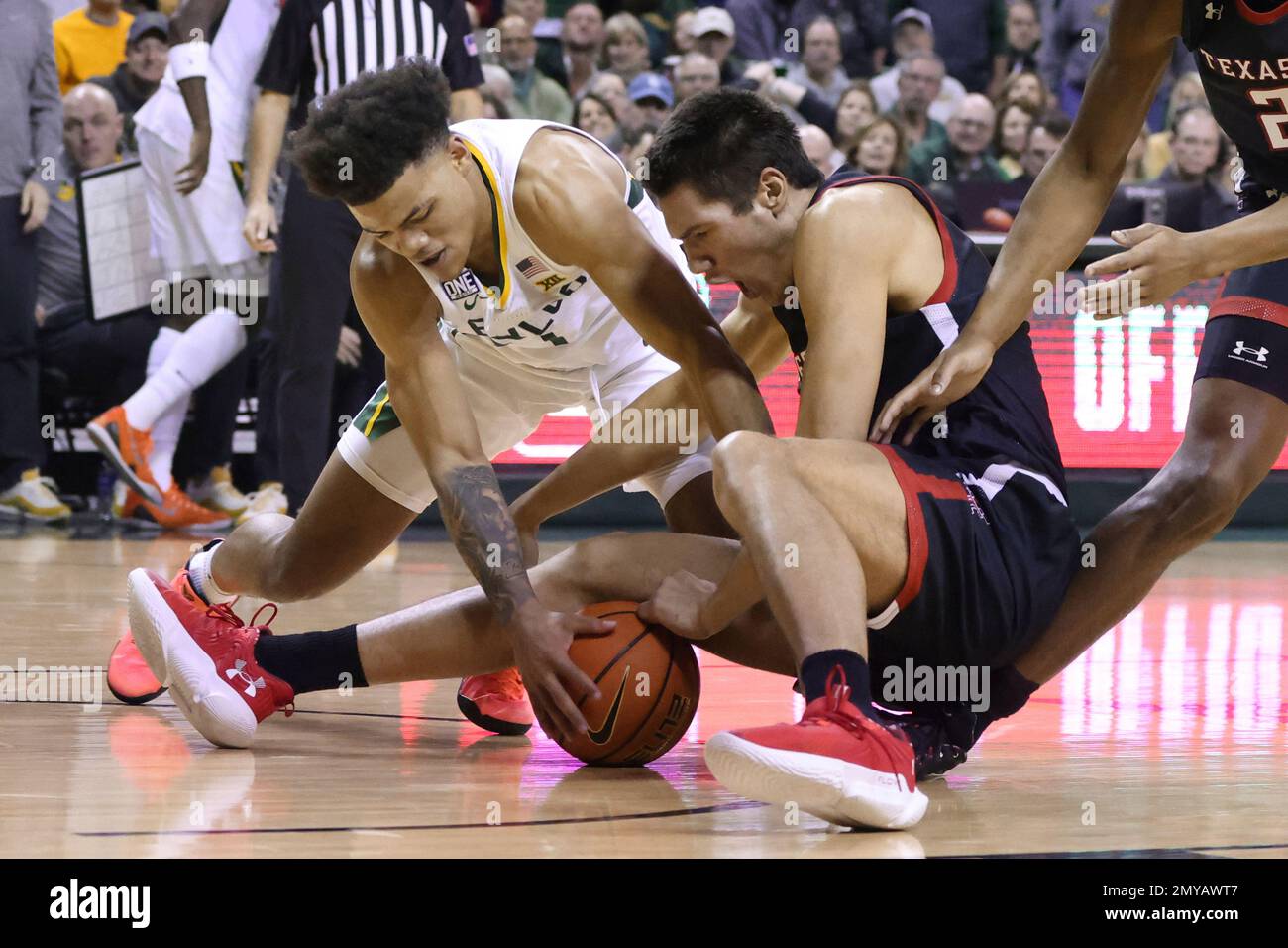 Baylor guard Keyonte George, left, battles Texas Tech forward Daniel ...