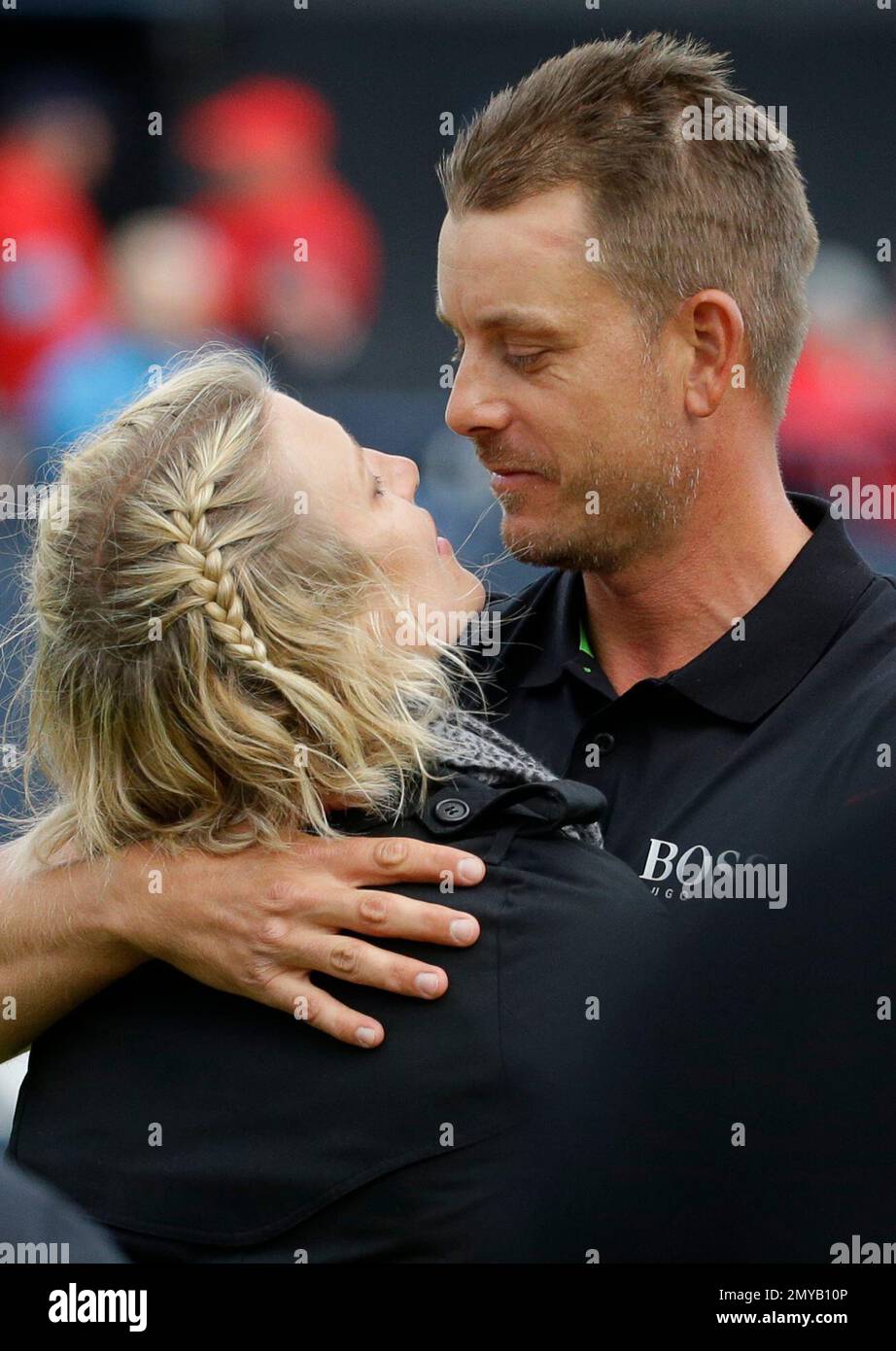 Henrik Stenson of Sweden looks at his wife Emma Lofgren after winning ...