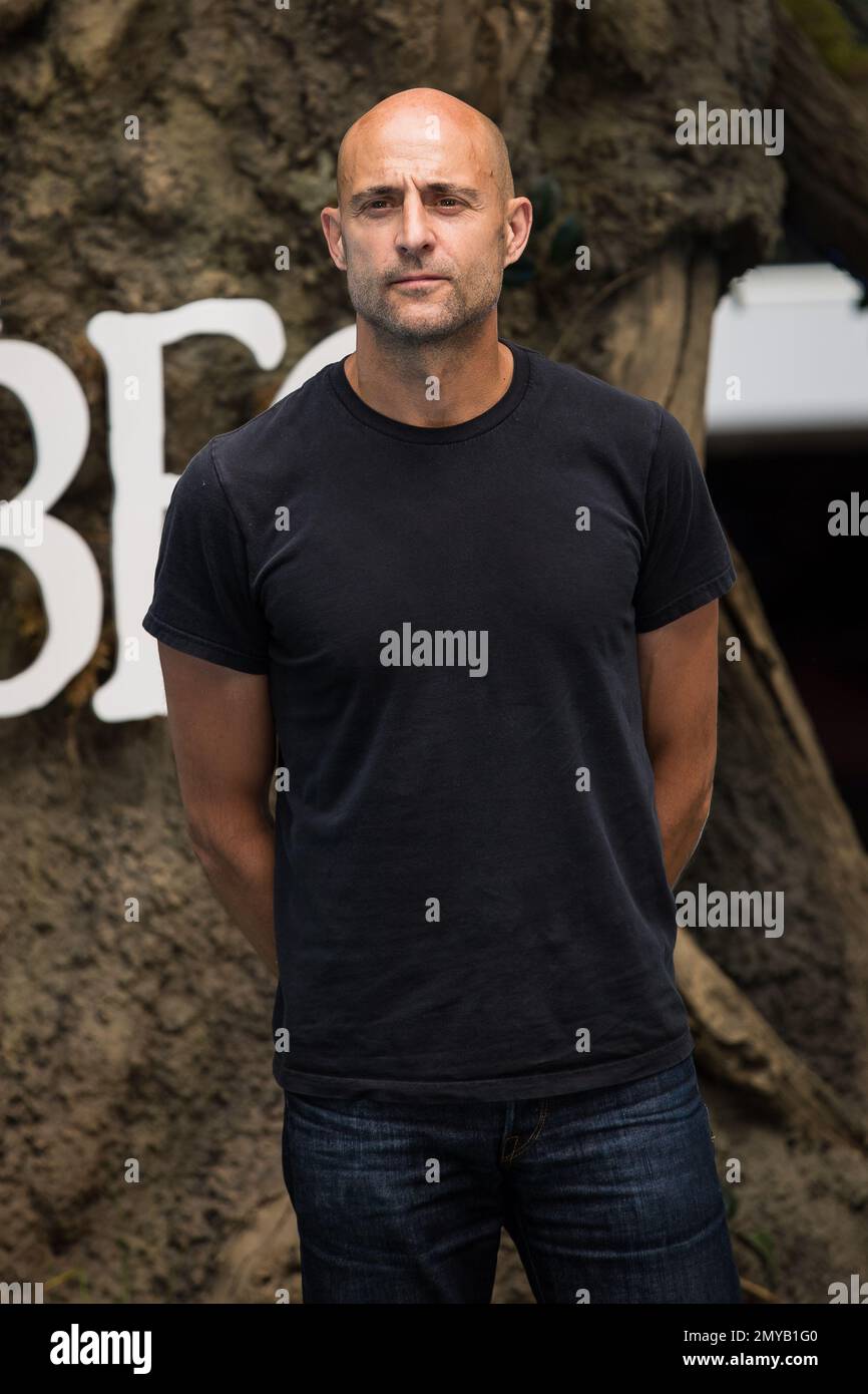 Actor Mark Strong poses for photographers upon his arrival at the ...