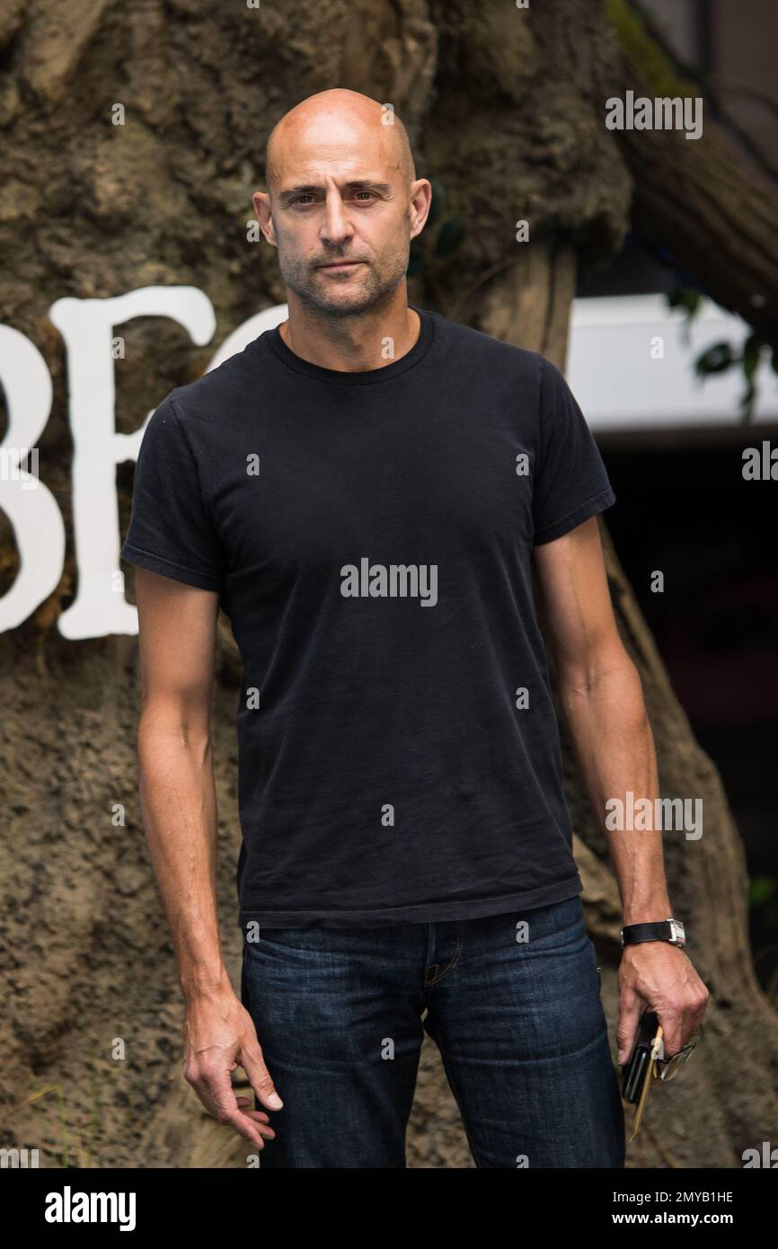 Actor Mark Strong poses for photographers upon his arrival at the ...
