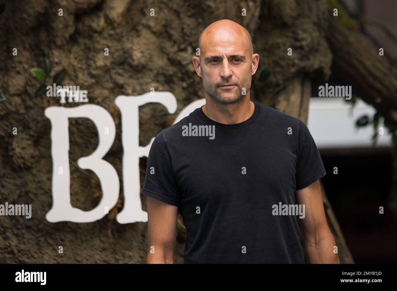 Actor Mark Strong poses for photographers upon his arrival at the ...
