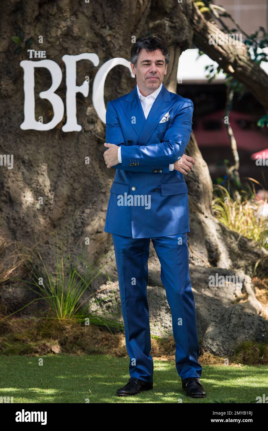 Jonathan Holmes poses for photographers upon arrival at the premiere of ...