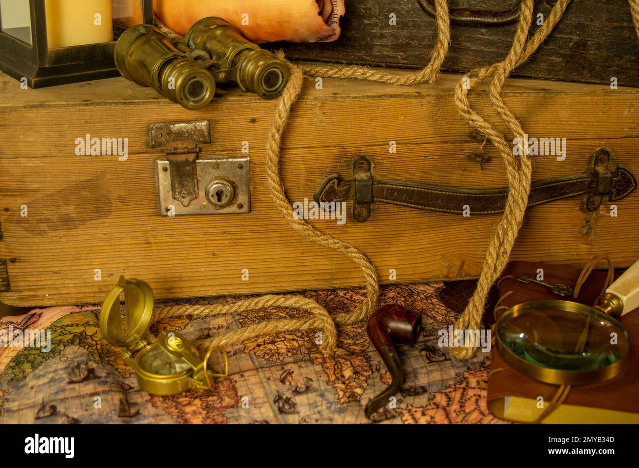 Antique adventure scroll background on adventurer table. Binoculars ...