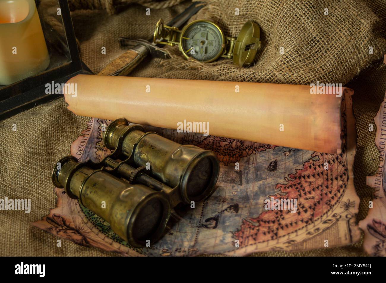 still life of adventure objects for exploration binoculars, compass ...