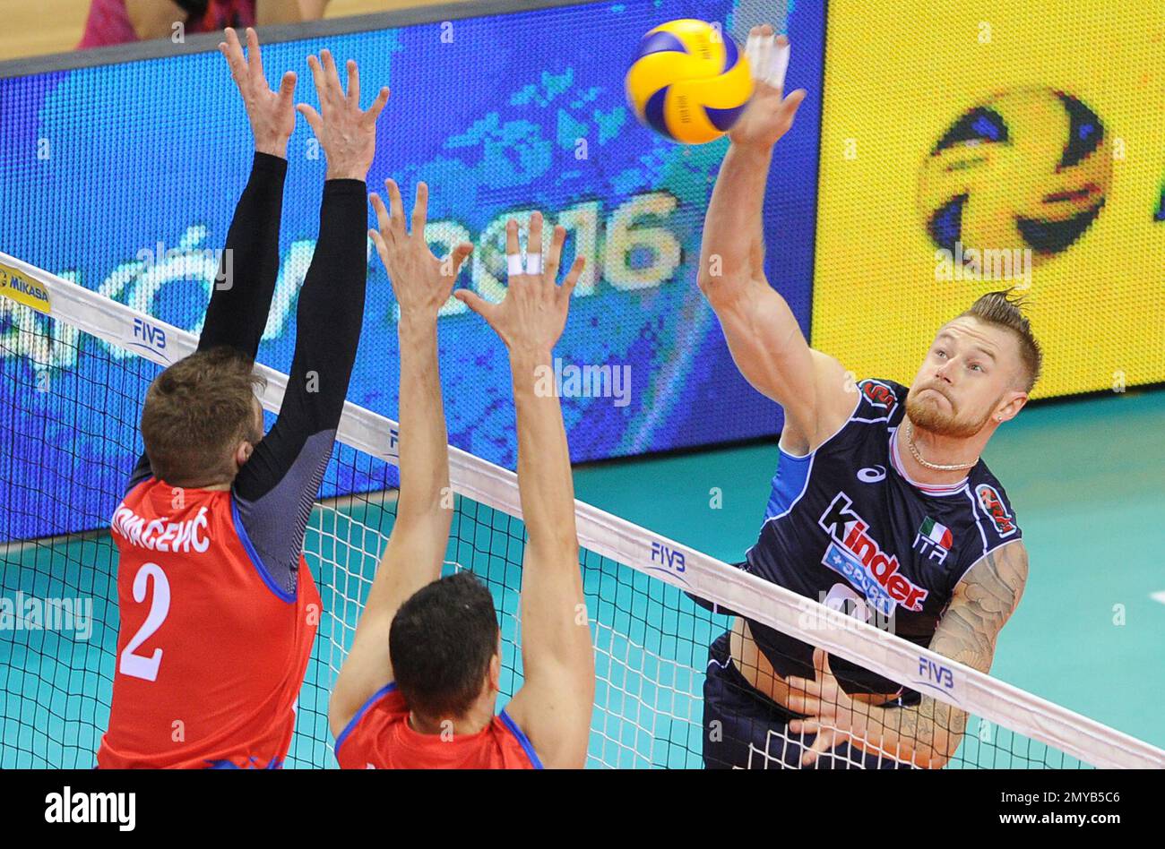 Italy's Ivan Zaytsev, right, spikes the ball against during Sebia's ...