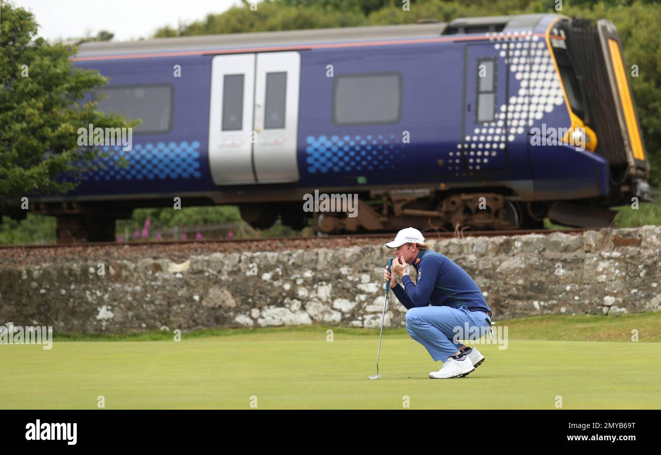 Brandt Snedeker of the US waits to put on the 11th green as a passenger ...