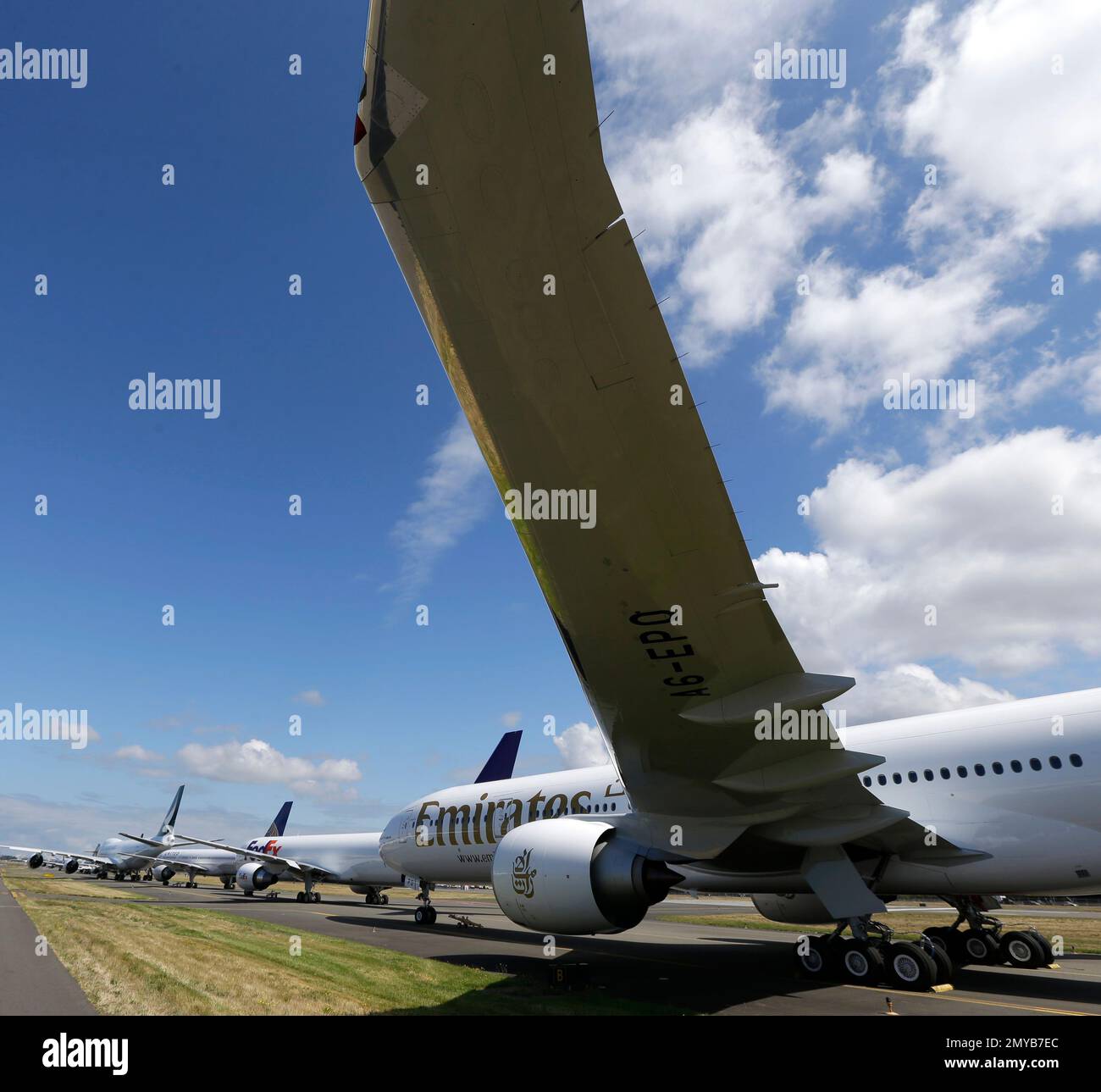 Boeing 7-series passenger airplanes, including an Emirates 777, right ...
