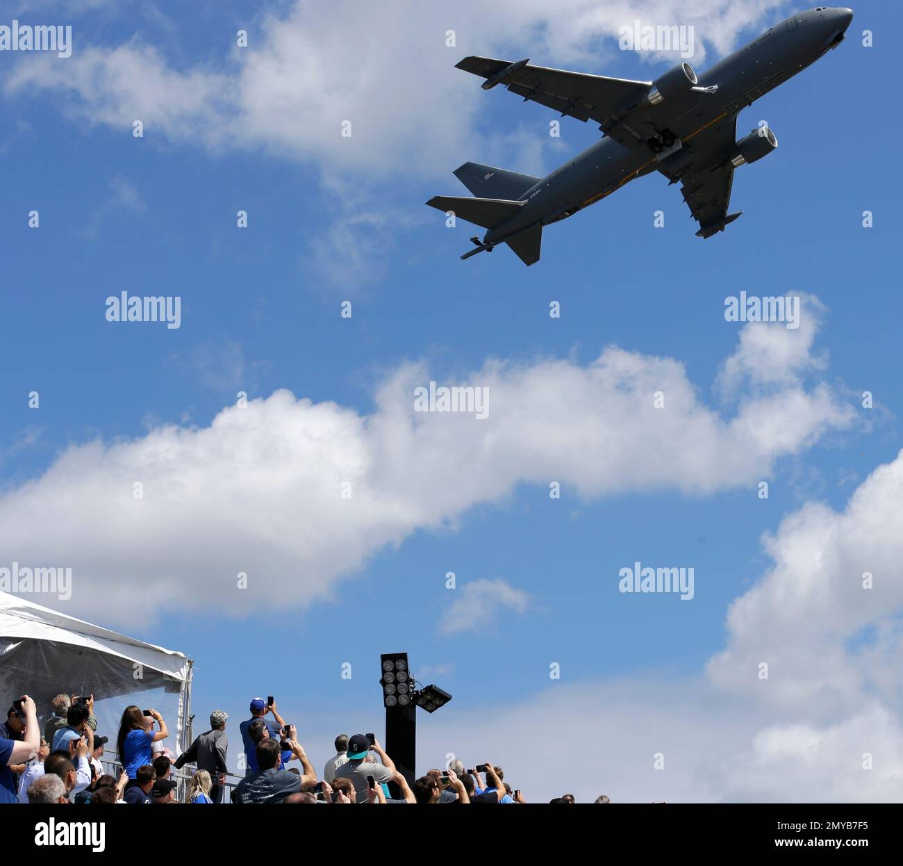 A Boeing 767 tanker flies over crowds at a ceremony marking the 100th ...