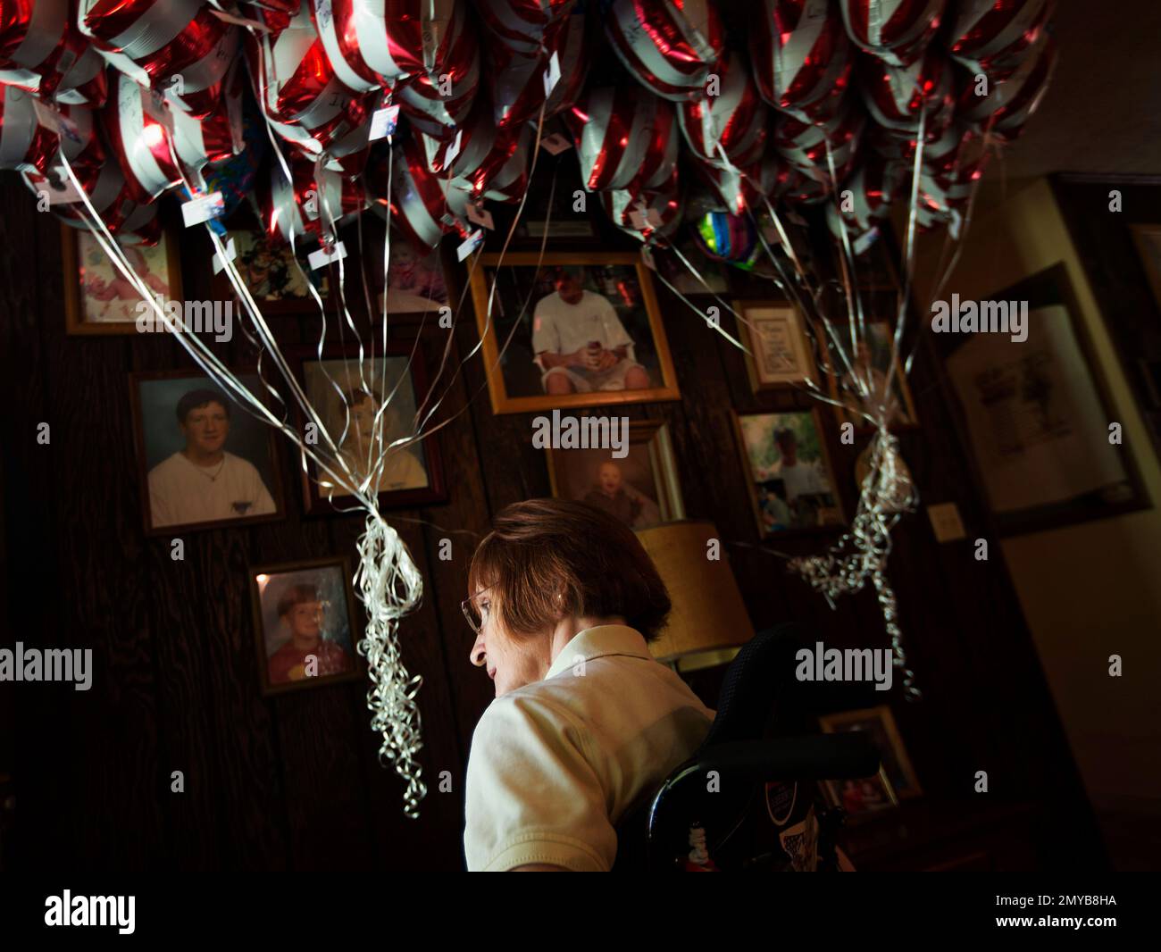 IMMIGRATION: Kathy Inman sits in her wheelchair next to balloons she ...