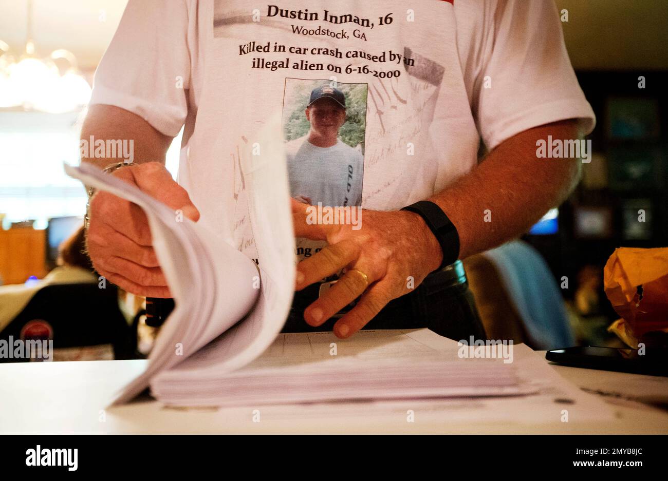 IMMIGRATION: Billy Inman flips through pages of medical bills for ...