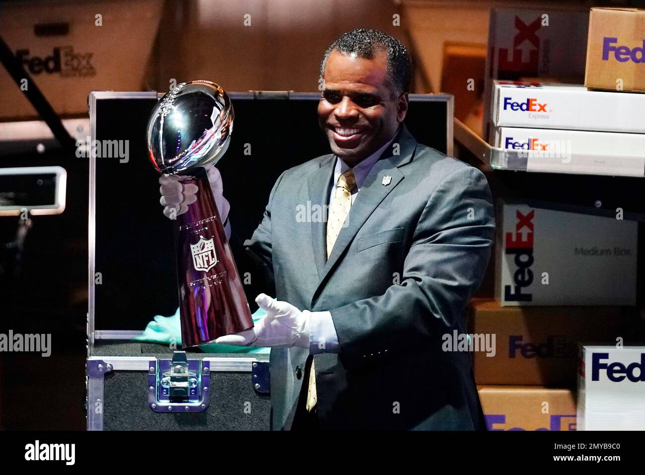 Darrell Foxworth, of NFL Security, smiles as he holds up the Vince ...