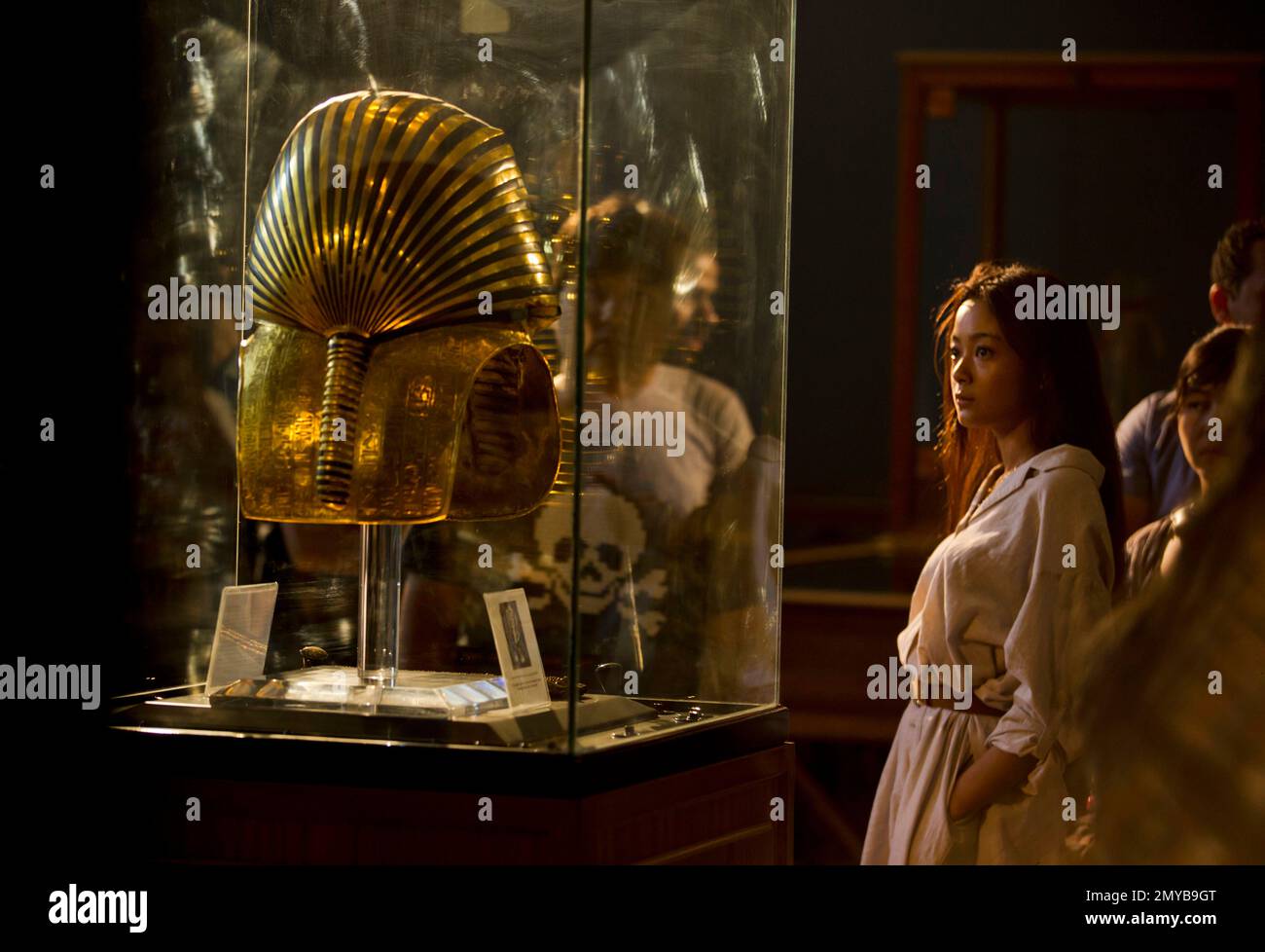 FILE - In this July 14, 2016 file photo, visitors look at the gold mask ...