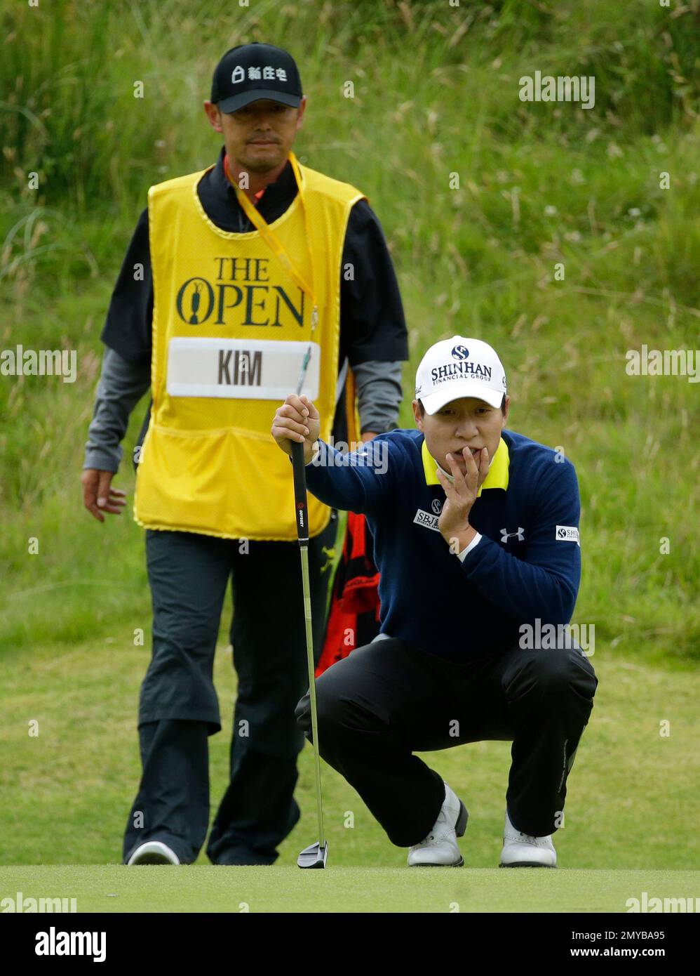 KT Kim of Korea look at his putt on the 4th green during the second ...