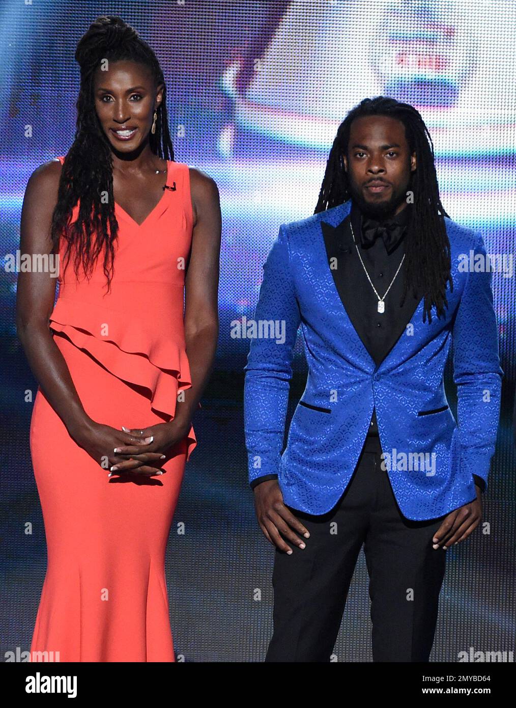 Lisa Leslie, left, and Richard Sherman speak at the ESPY Awards at the ...