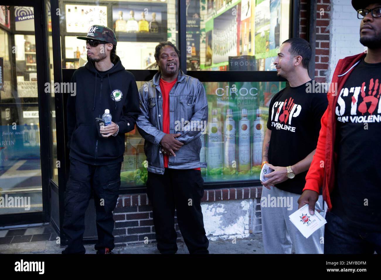 Mike Perry, left, and other members of the Cure Violence group, meet ...