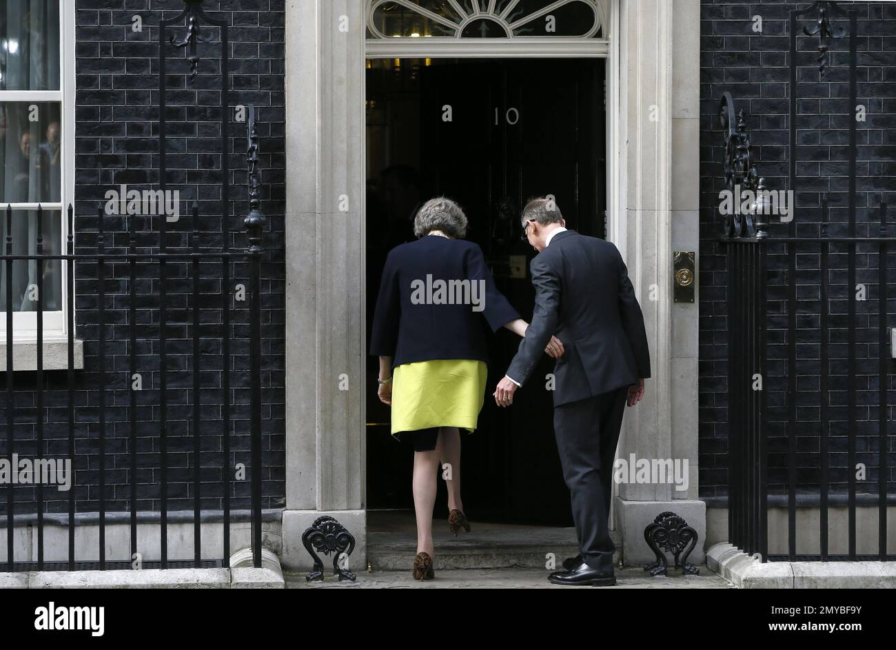 New British Prime Minister Theresa May and her husband Philip May enter ...