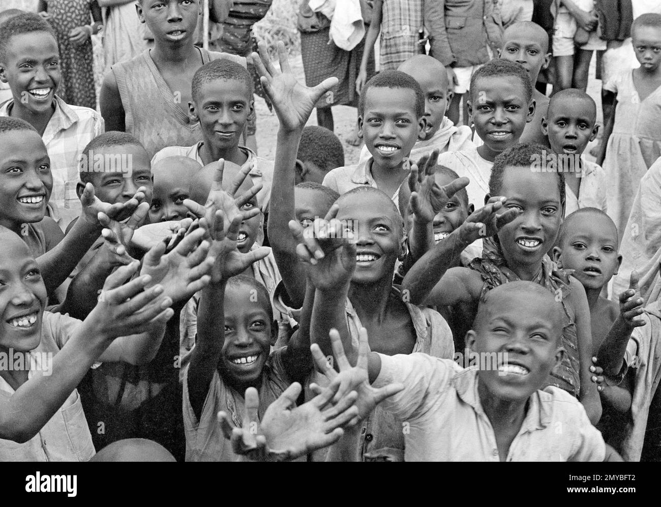 Children of the Tutsi tribe clamor for food as they arrive at a refugee ...