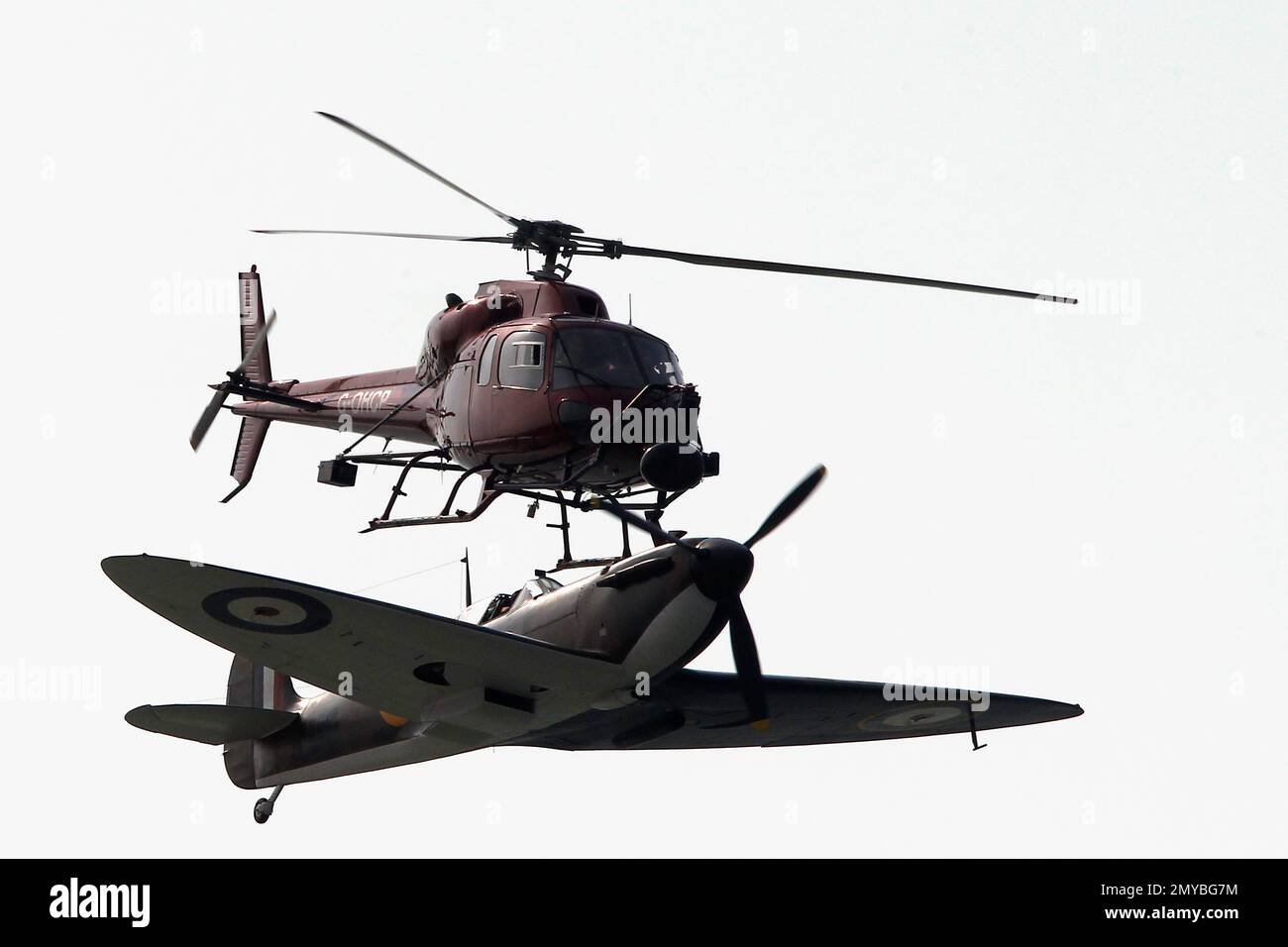 A fighter plane in the air over the beach during filming a scene for ...