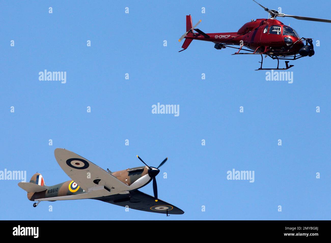 A fighter plane in the air over the beach during filming a scene for ...