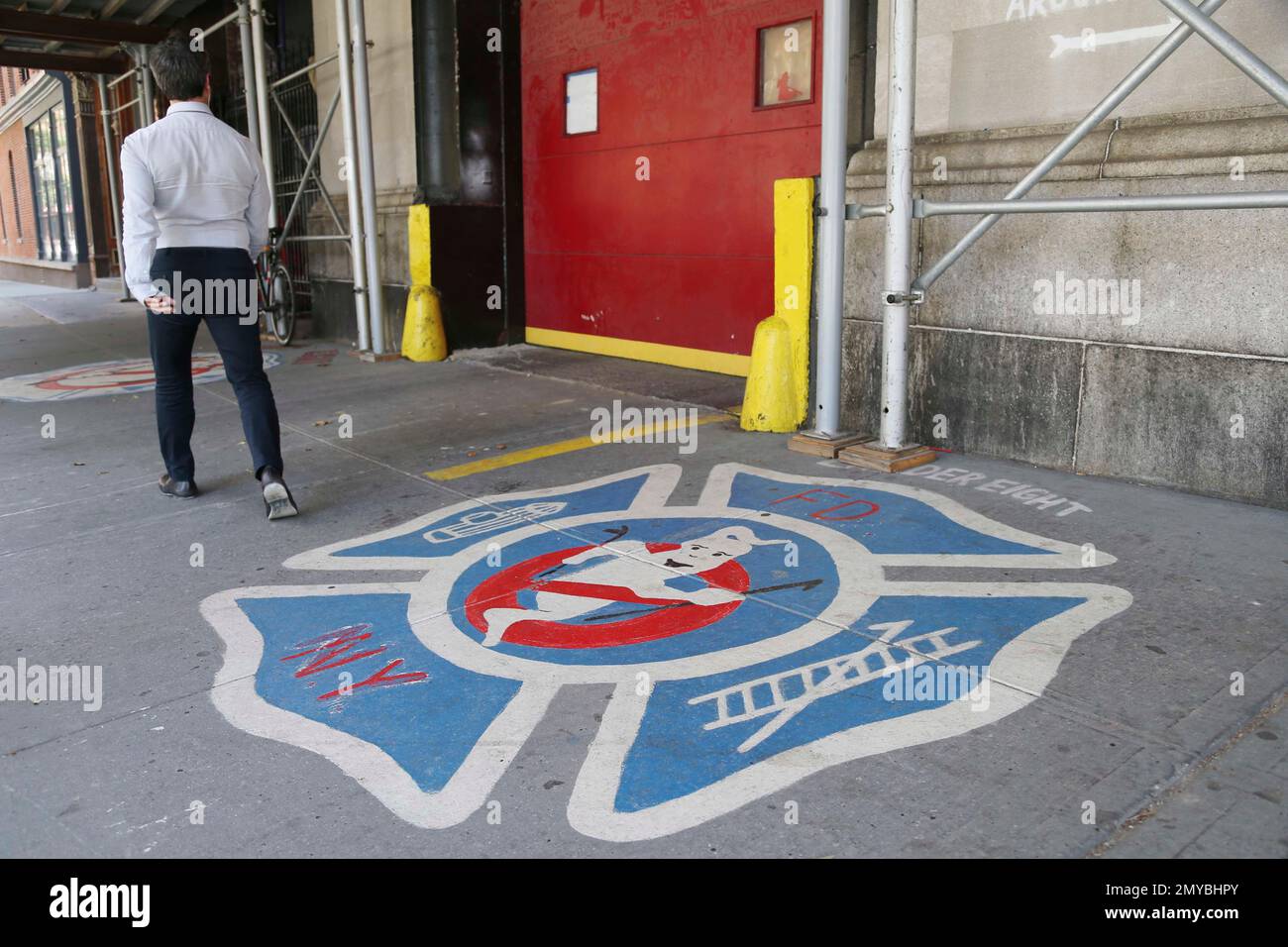 A man walks past the firehouse that was featured in the 1984 movie ...