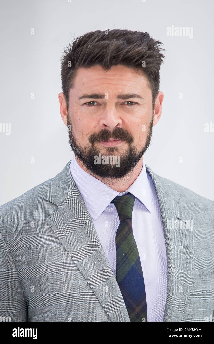 New Zealand actor Karl Urban poses for photographers upon arrival at ...