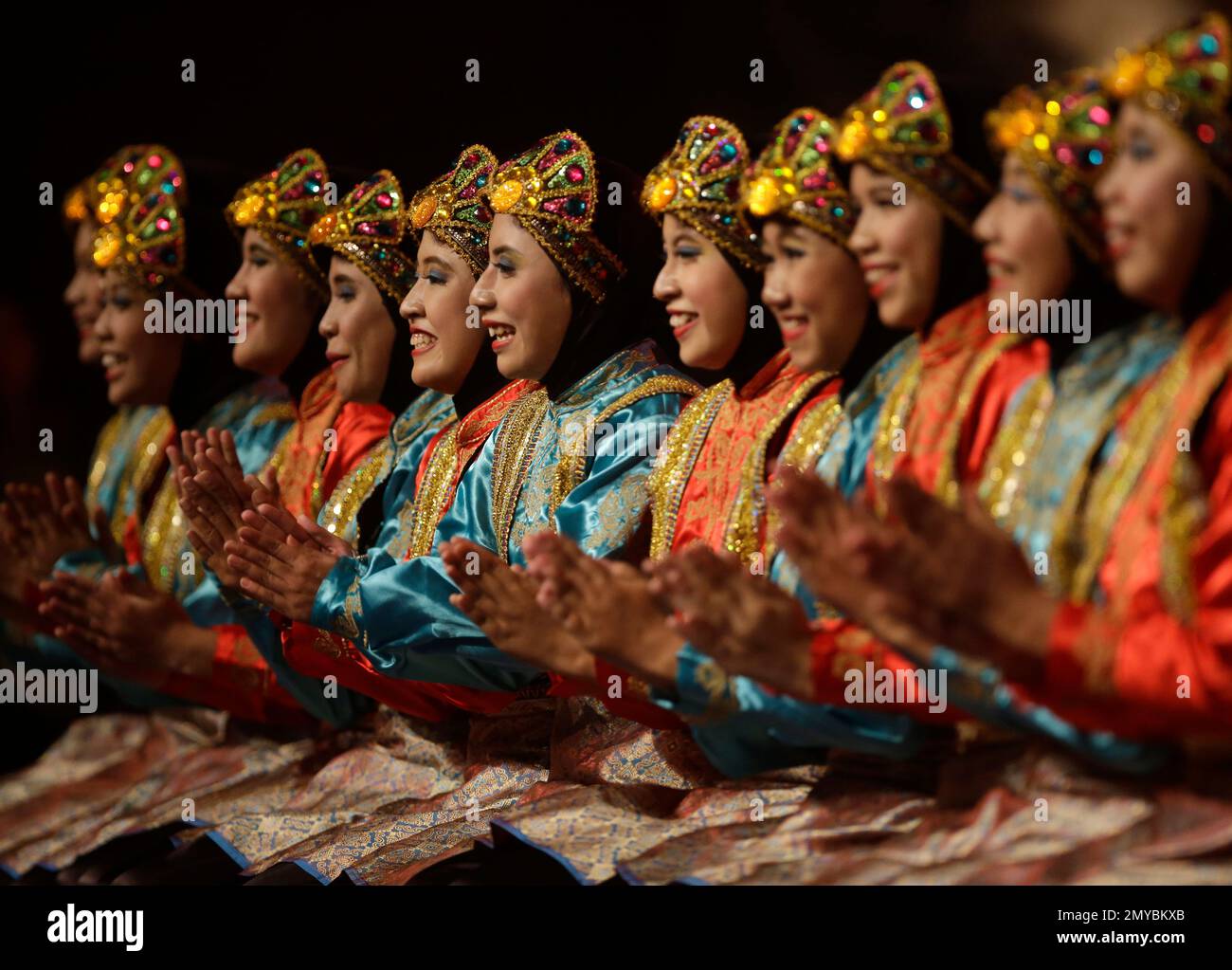 Dancers perform traditional Acehnese Saman dance during the opening ...
