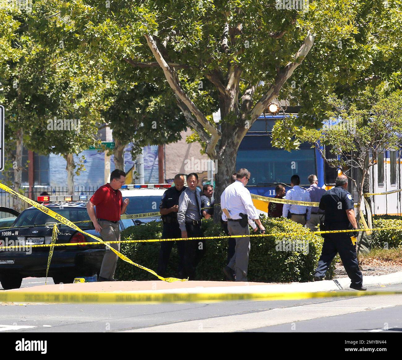 Crime scene tape surrounds the area as Sacramento Police officers ...