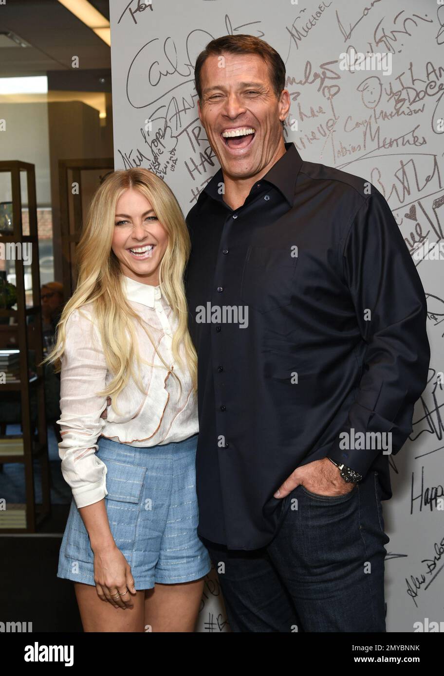 Actress Julianne Hough greets Tony Robbins backstage at AOL's BUILD Speaker Series to discuss ...