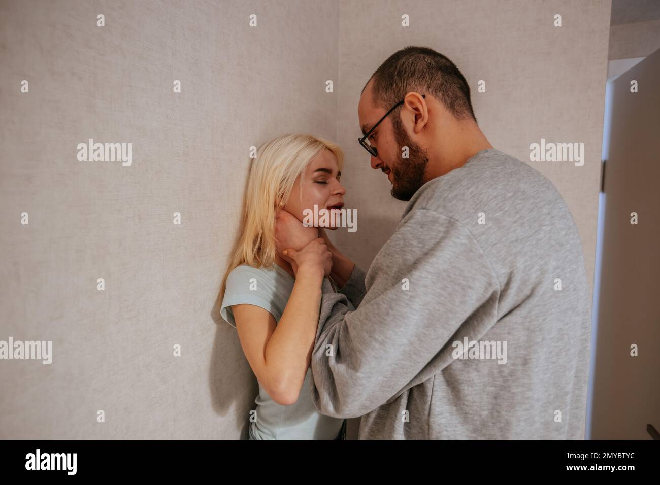 Angry man strangles a woman. Domestic violence concept Stock Photo - Alamy