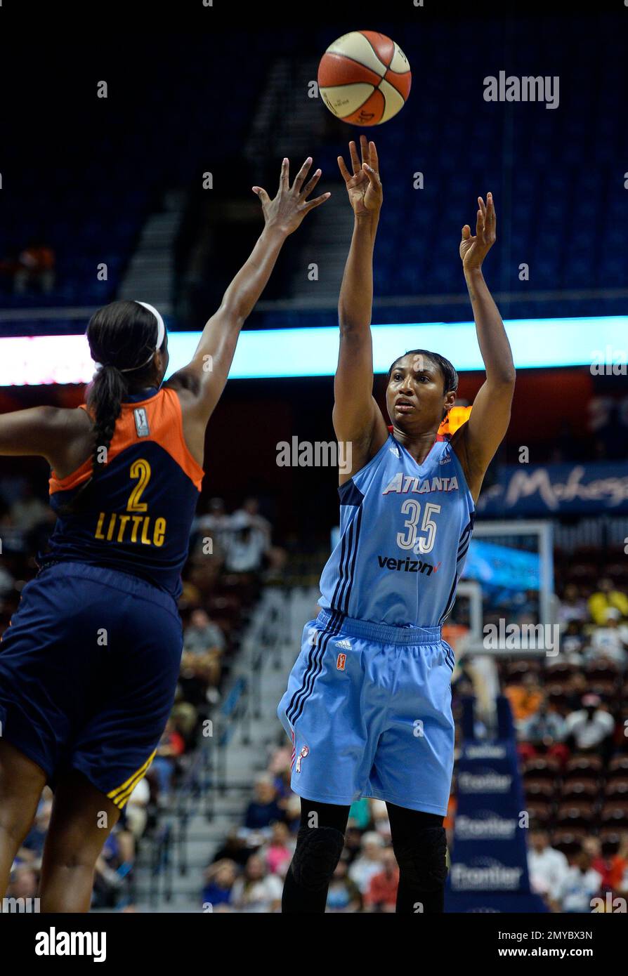 Atlanta Dream's Angel McCoughtry, right, shoots over Connecticut Sun's ...