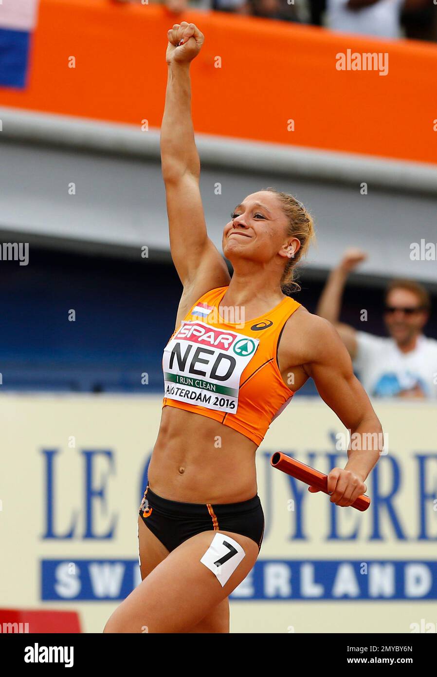 Netherlands' Naomi Sedney celebrates after crossing the line as the ...