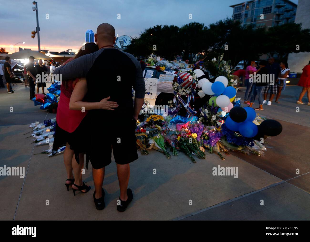 Alex Pacheco and Holly Caperton visit a makeshift memorial in honor of ...