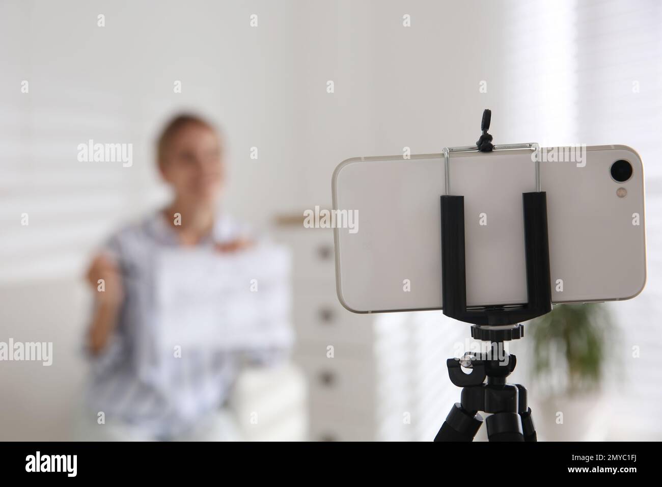 Teacher giving online school lesson, focus on phone. Distance learning ...