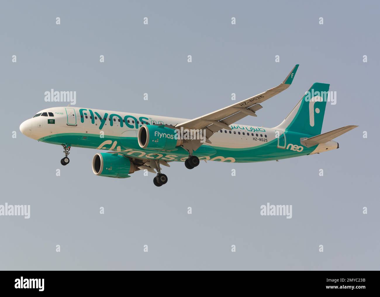 A flying Airbus A320 Flynas arriving at Dubai International Airport ...