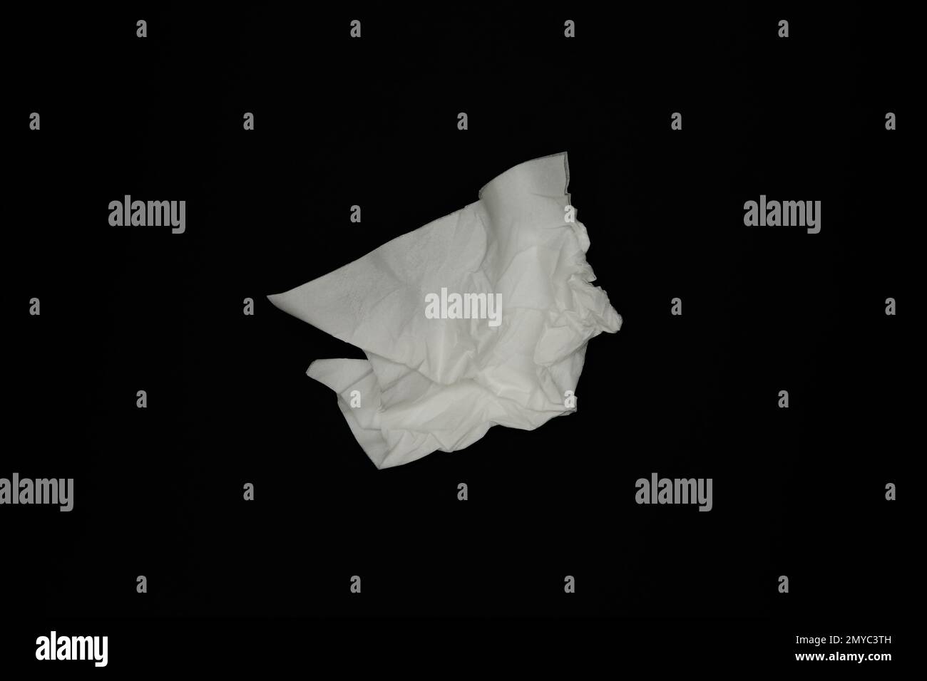Used white paper tissue on black background Stock Photo - Alamy