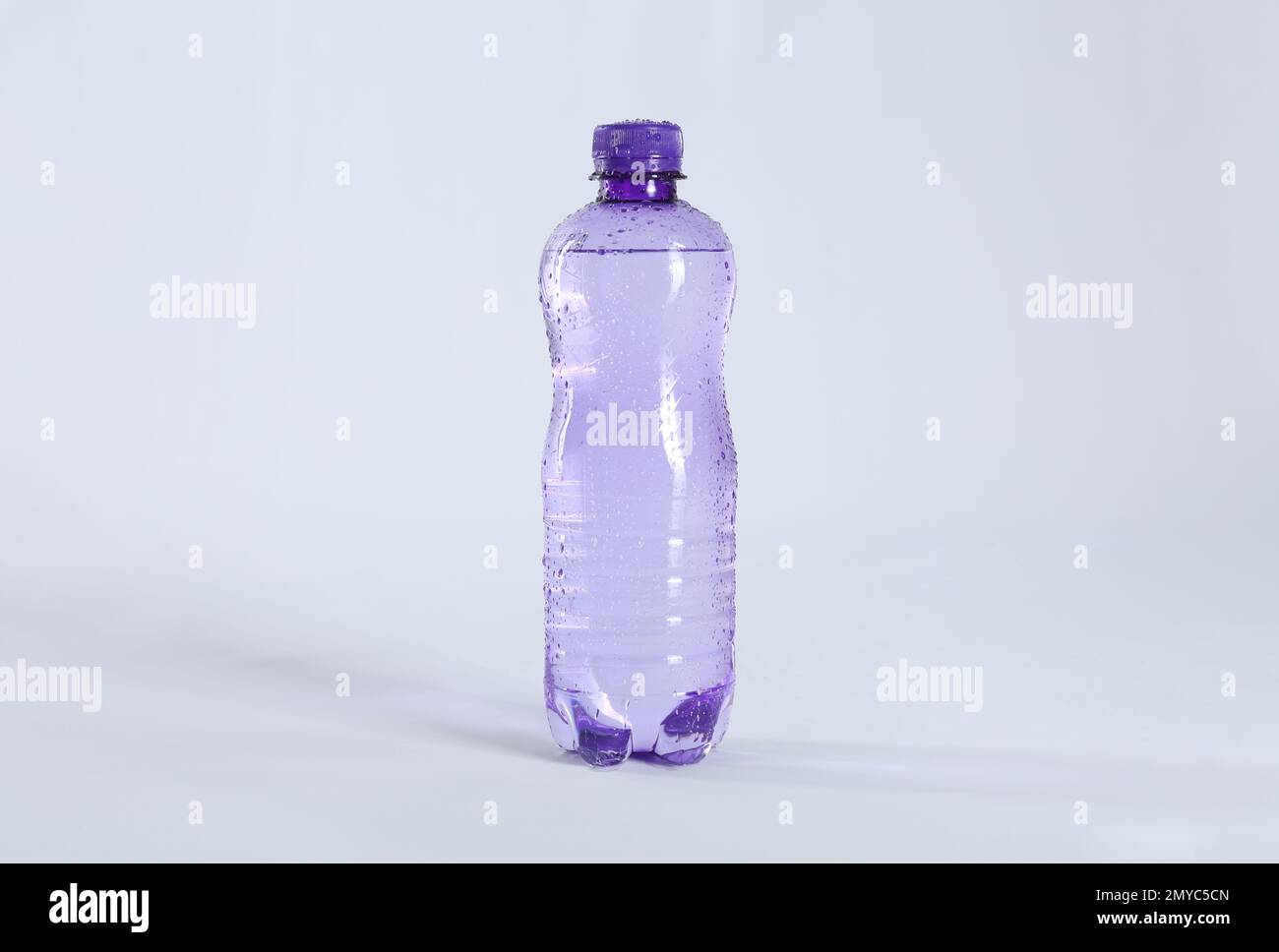 Plastic bottle of pure water on light background Stock Photo - Alamy