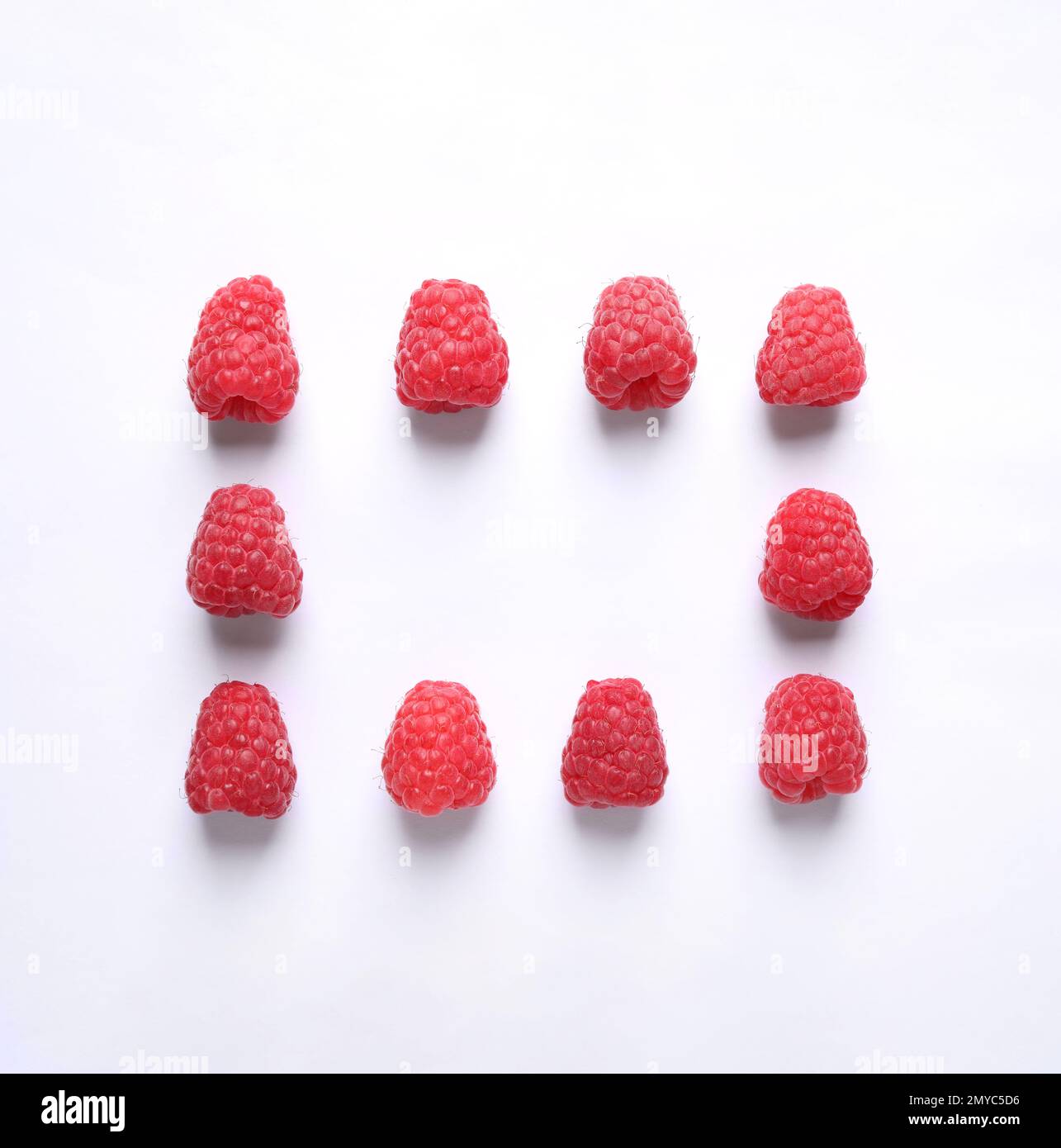 Frame of delicious ripe raspberries on white background, top view ...