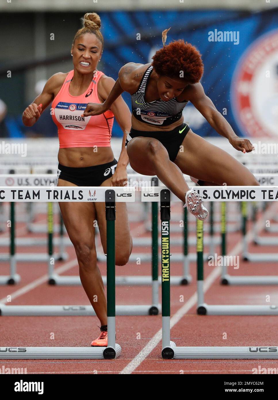 Brianna Rollins, right, clears the last hurdle past Queen Harrison in ...